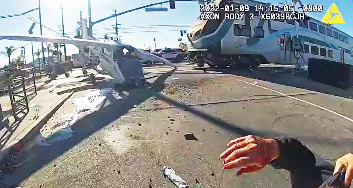 Pilot Pulled From Crashed Plane Seconds Before Train Pulverizes It: Video