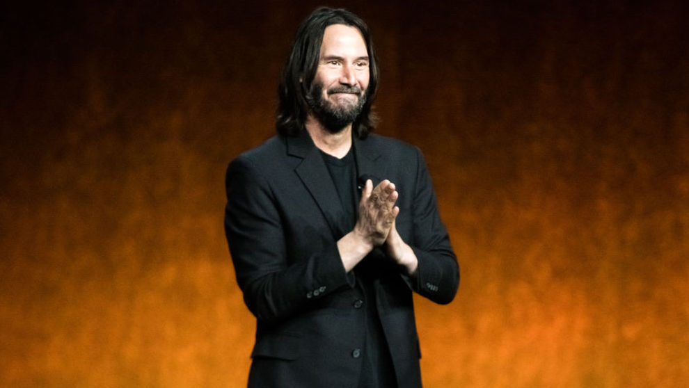 PHOTOS: Keanu Reeves Spotted At Airport Chatting With Young Fan