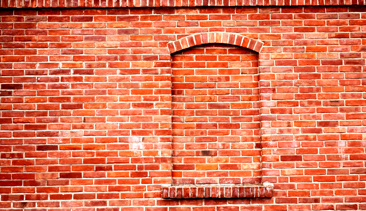 Why Do Some Buildings Have Bricks Covering The Windows?