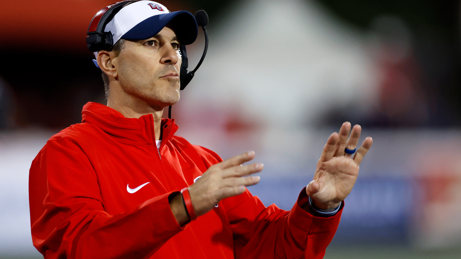Liberty Coach Hilariously Shades Michigan Amid Scandal