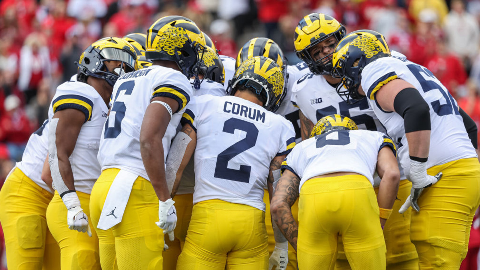 Michigan Uses Ironic Tactic To Block Camera From Filming Huddle