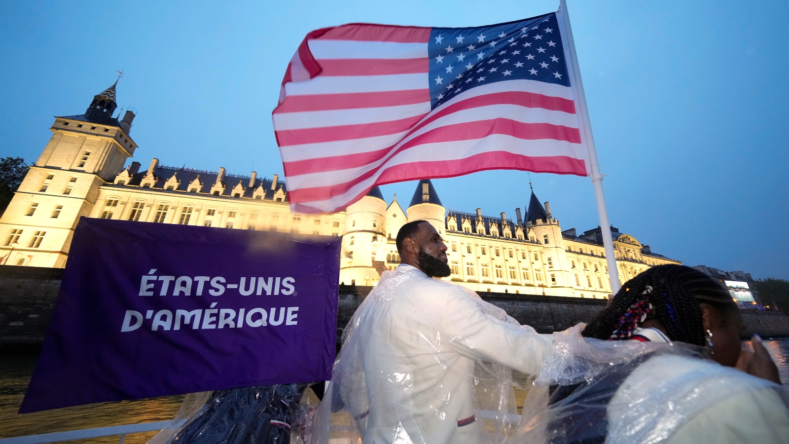 Photo Of LeBron James Holding American Flag While Rain Pours