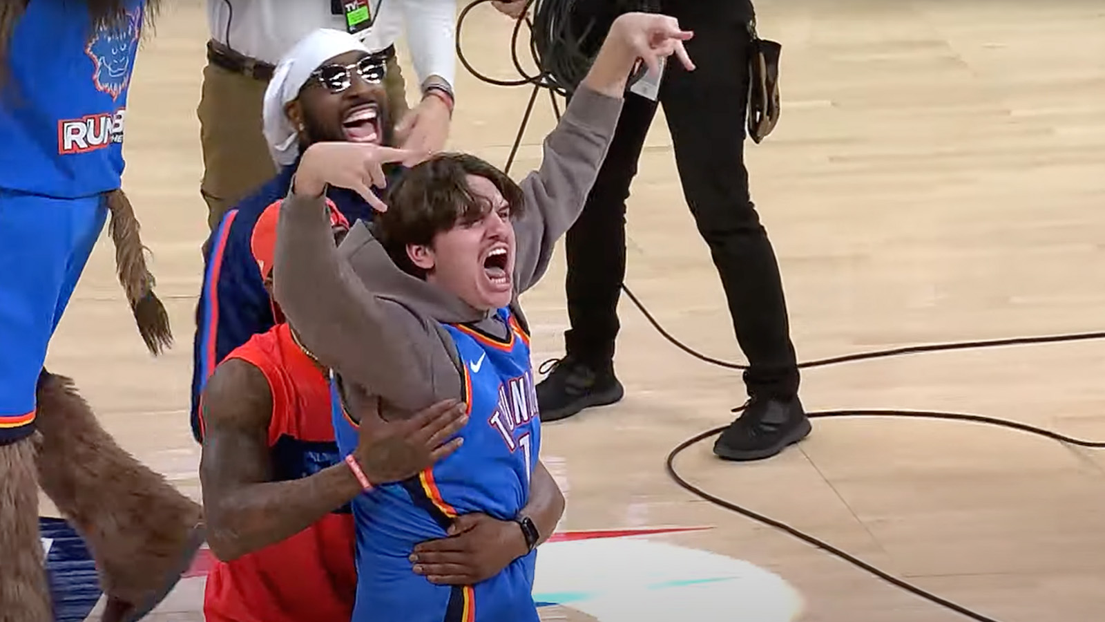 Oklahoma Fan Hits 'Horns Down' After Half-Court Shot For $20,000