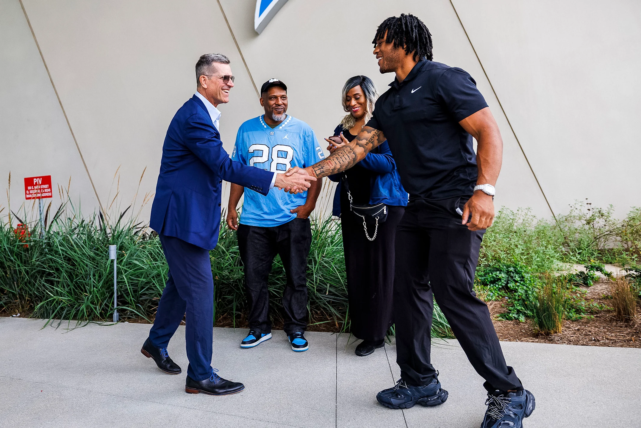 Omarion Hampton Dwarfs Jim Harbaugh In Wildly Deceptive Photo
