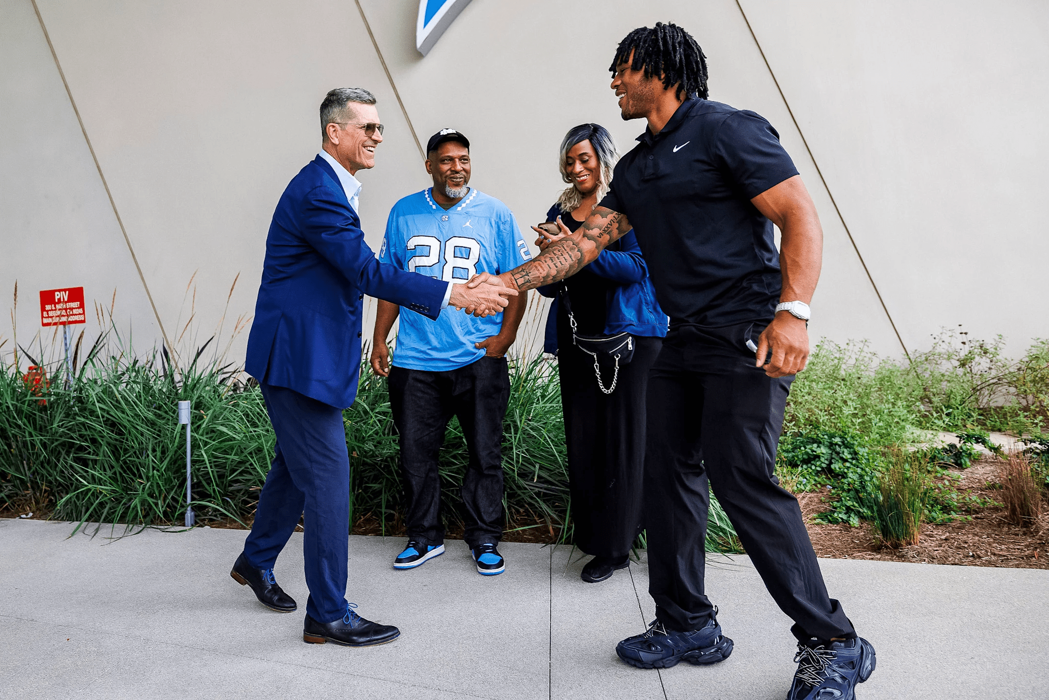 Omarion Hampton Dwarfs Jim Harbaugh In Wildly Deceptive Photo