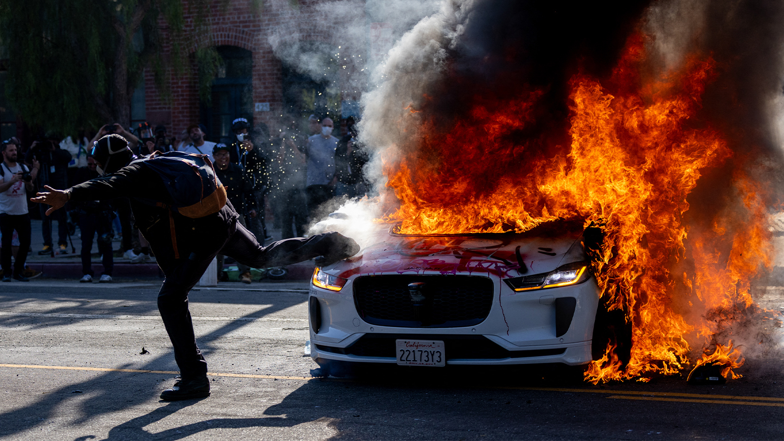 Waymo Suspends LA Service After Protesters Burn Cars