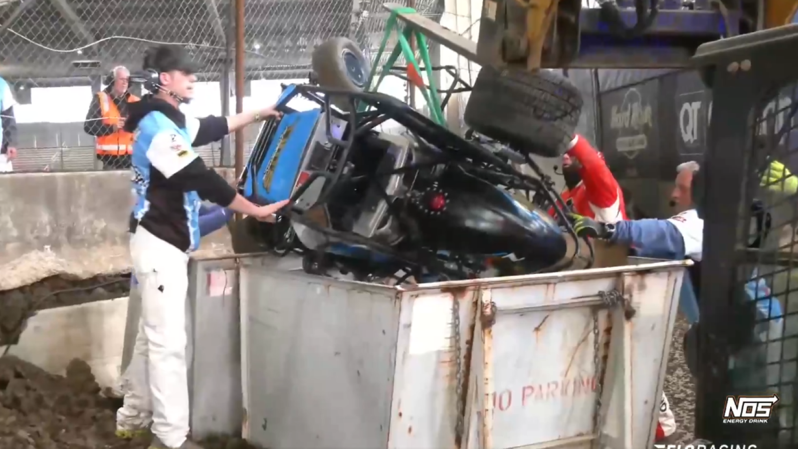 Crazy Dirt Racing Crash Ends With Car Lodged In Dumpster