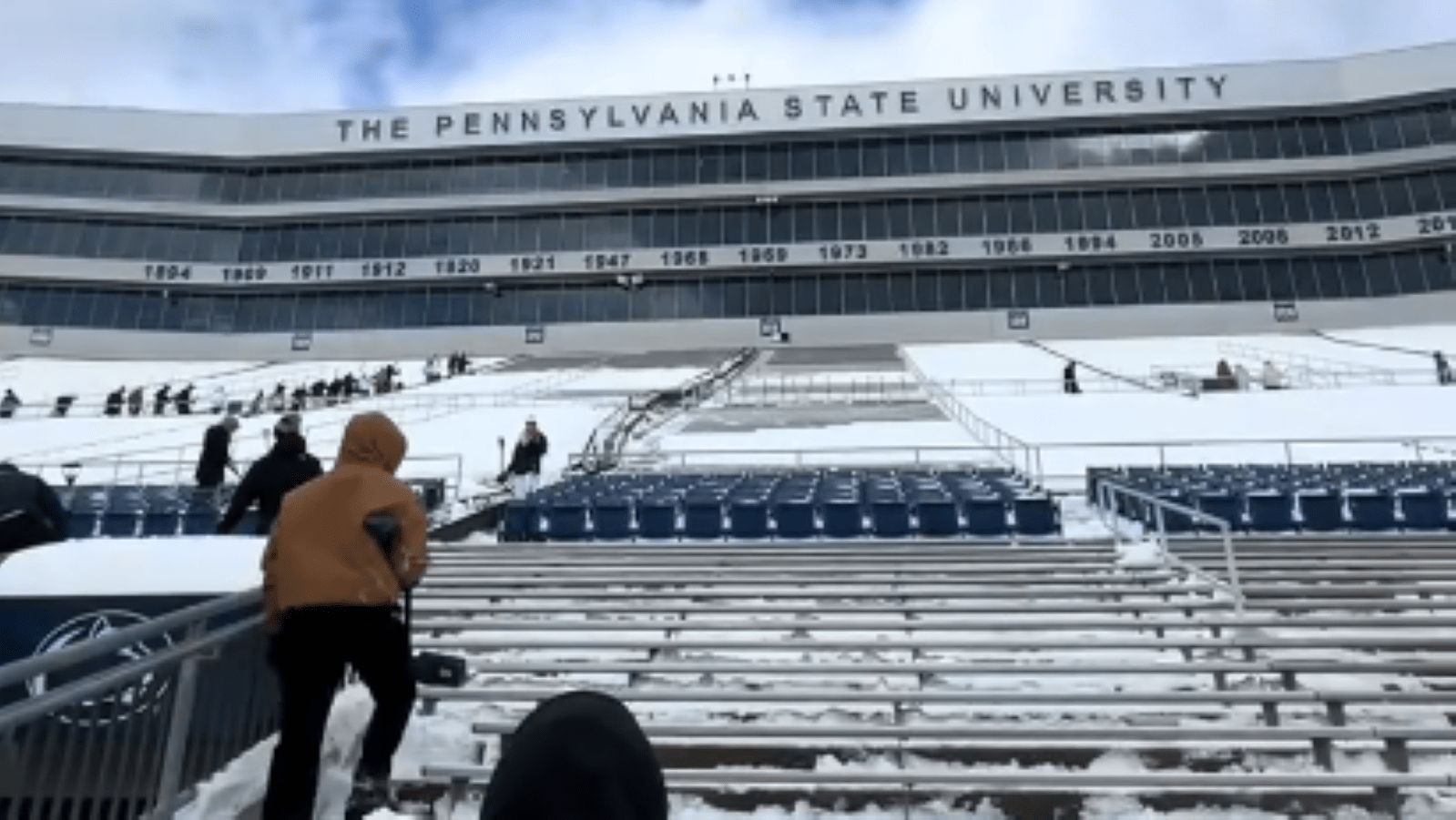 Penn State Students Shovel Out Beaver Stadium For Outdoor Hockey Game